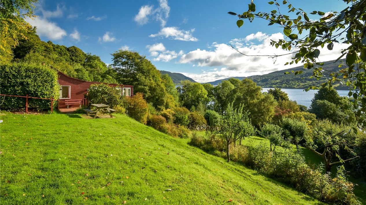 Charming waterfall cottage offers spectacular lochside living in ...